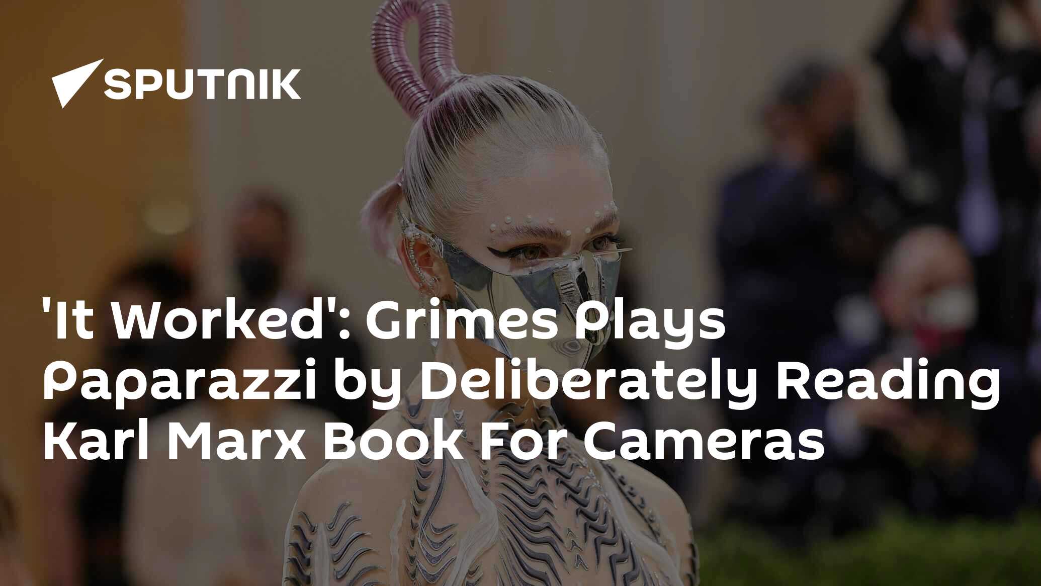 'It Worked': Grimes Plays Paparazzi by Deliberately Reading Karl Marx ...