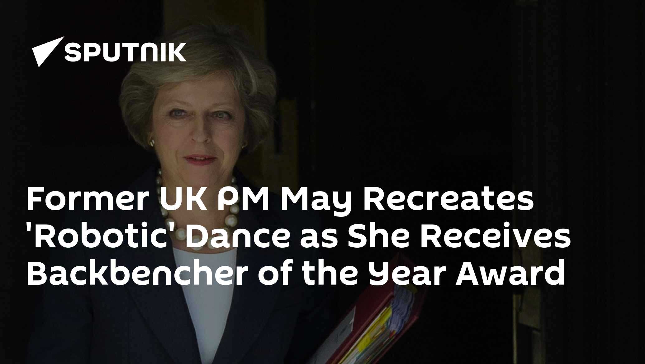 Former UK PM May Recreates 'Robotic' Dance as She Receives Backbencher ...
